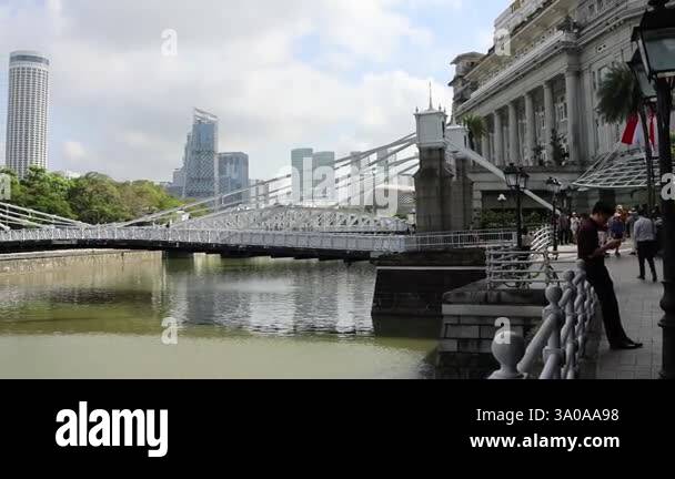 Singapore- 21 Feb 2025: Cavenagh Bridge over the Singapore River. It is ...