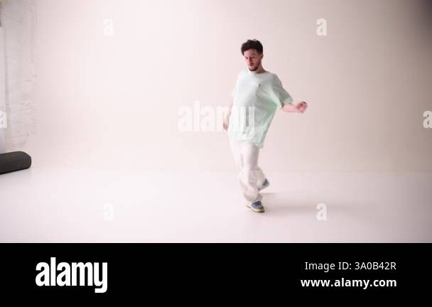 Young artistic man dressed casual, oversized stylish outfit, dance ...