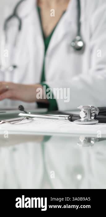 Stethoscope and medication history records form are lying on a glass ...