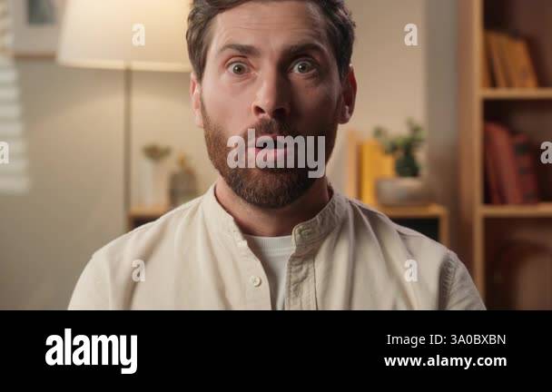 Caucasian man shocked surprised male homeowner looking at camera home positive amazed guy happy ...