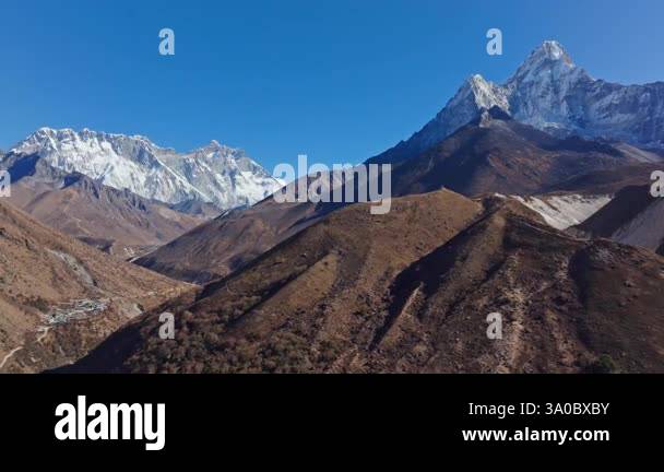 Aerial view revealing Mount Everests massive peak and Ama Dablam ...
