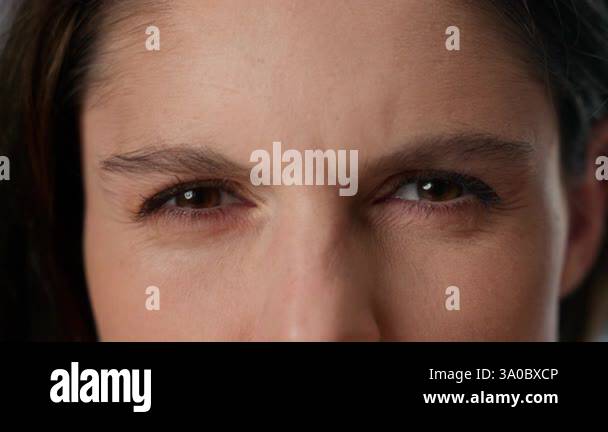 Extreme close-up view female dark human eyes Caucasian woman girl gaze ...