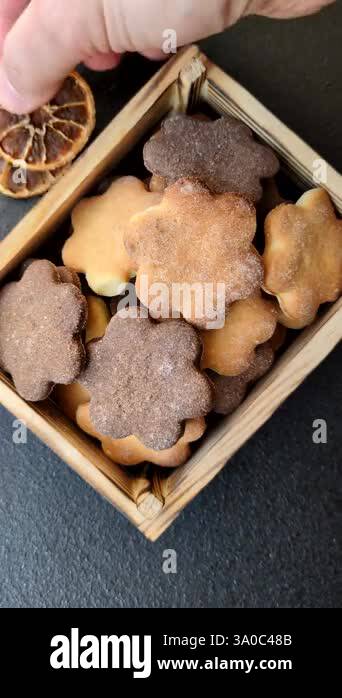 Ginger sweet cookies in yellow and brown color on dark concrete ...