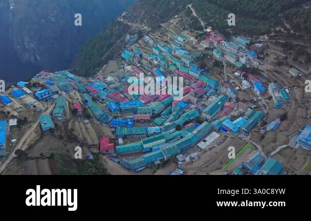 Namche Bazaar nestled among Himalayan peaks, revealing colorful ...