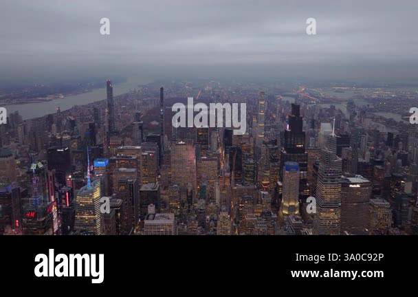 Twilight descending over Midtown Manhattan, glowing skyscrapers rising ...