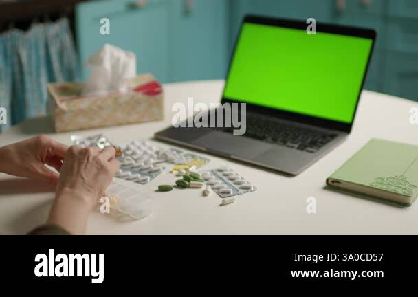 A sick woman sits at home, engaged in an online conversation using a ...