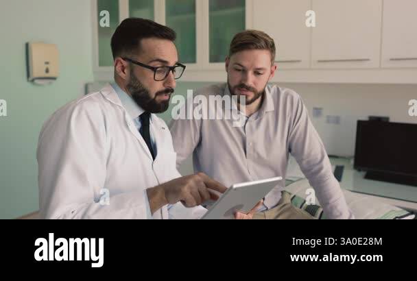 Positive young Caucasian patient man consulting doctor at appointment ...