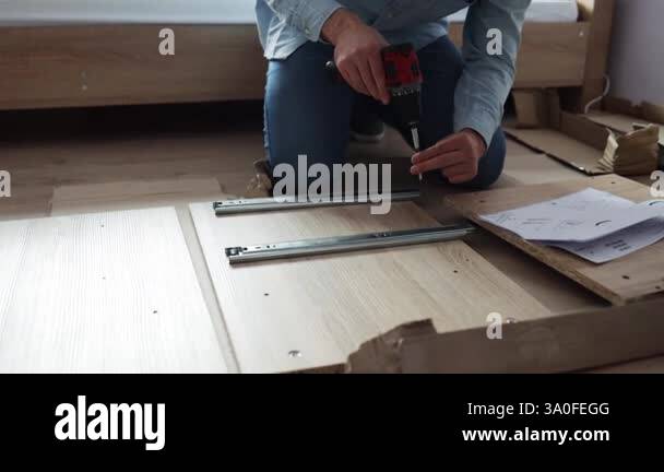 Professional Worker Furniture Assembler Controls the Operation of the ...