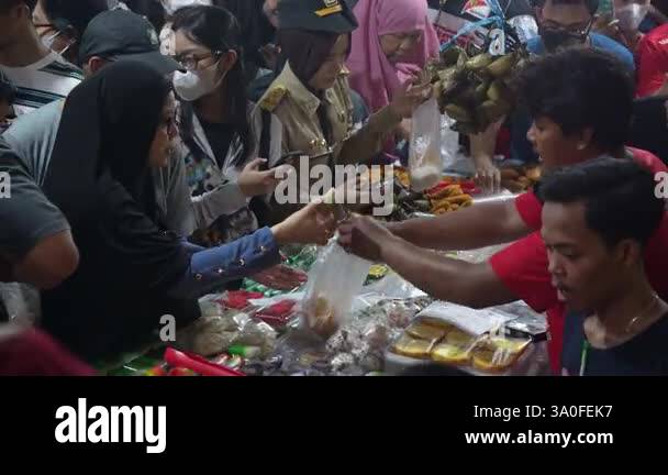 March 2, 2025. Jakarta, Indonesia. The atmosphere of the market selling cakes, food, and drinks ...