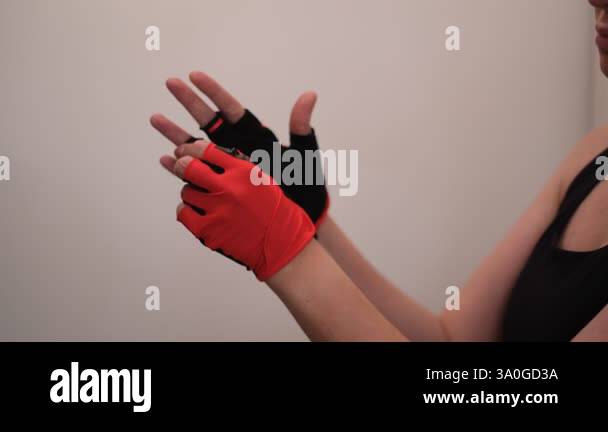 Woman taking off gloves after exercise close up of hands Stock Video ...
