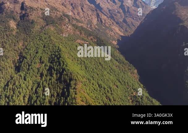 Towering Himalayan peaks overlooking lush green valleys, capturing epic ...