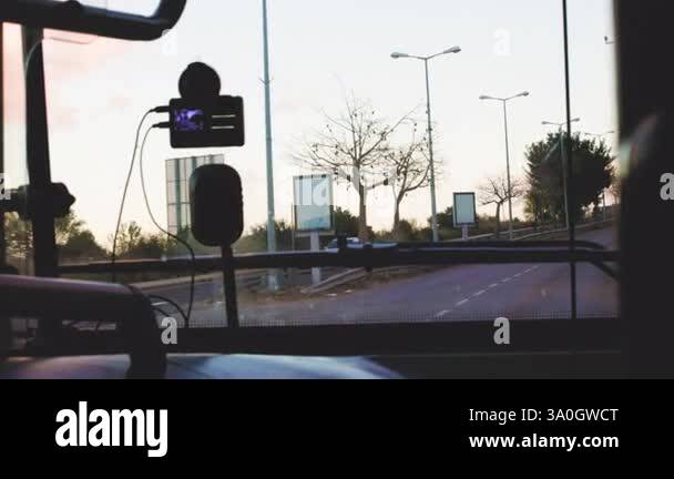 view from the bus window of the city and the road. public transport ...