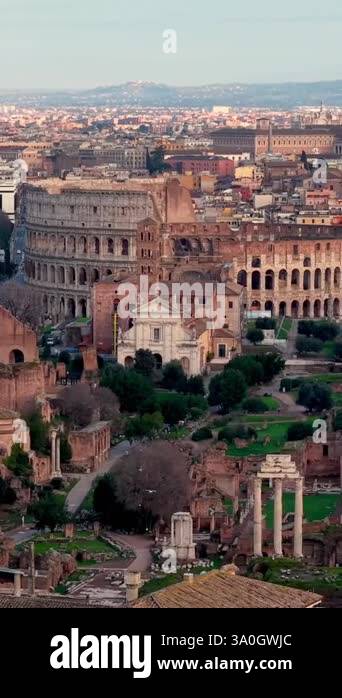 vertical Aerial view of old city center Roma, Illuminated houses after ...