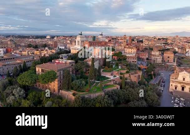 4k Aerial view of old city center Roma, Illuminated houses after sunset ...