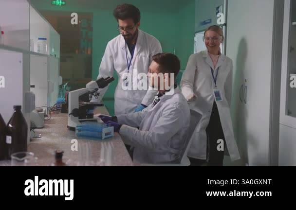 Group of multicultural people working in laboratory. Happy lab workers ...