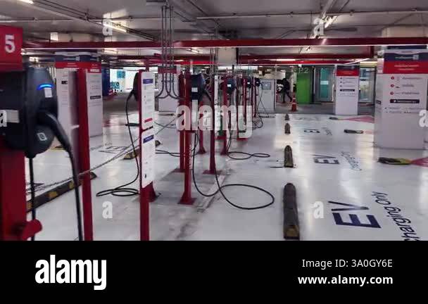 Modern EV charging station in a well lit parking showing all available ...