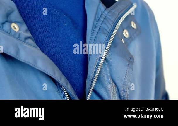 Close-up view highlighting a blue jacket with unique zipper and ...