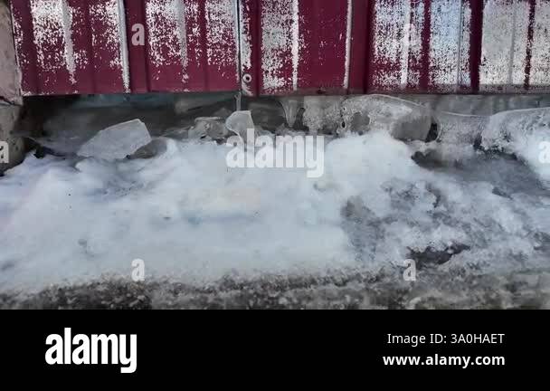 hard ice on the ground. Ice sculptures on the river bank in San Vigilio ...