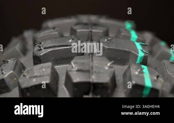 Spinning motorbike wheel tire. Black new rubber dirt bike tire rotation ...