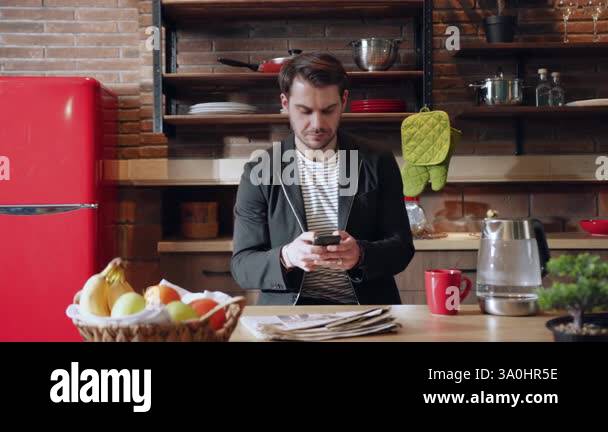 A modern kitchen scene featuring a man preparing food, showcasing ...
