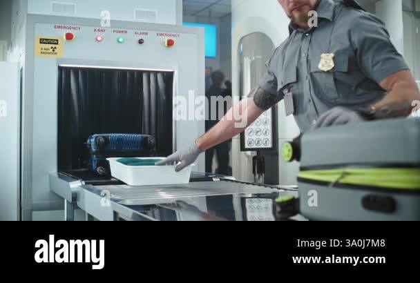 Airport Security Checkpoint: Security Officer Putting Suitcases and ...