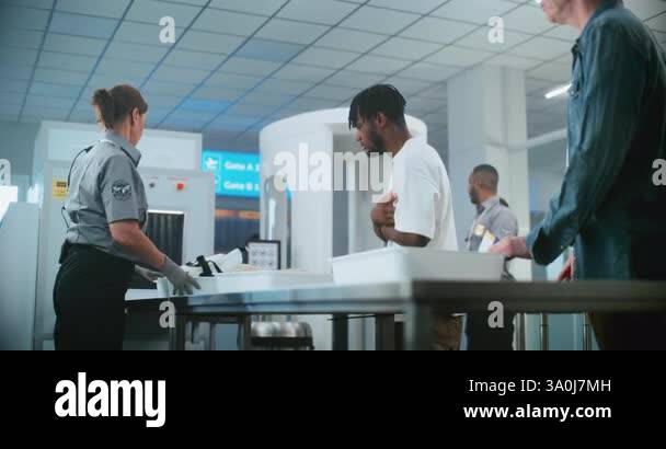 Security Checkpoint in Airport: Female Security Officer Takes Baggage ...