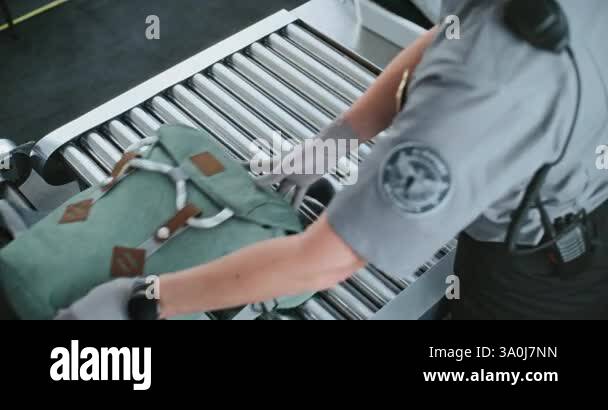 Security Checkpoint in International Airport Terminal: TSA Worker ...