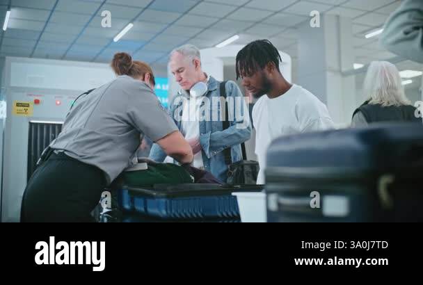 Security Checkpoint in Airport Terminal: Female TSA Worker Inspecting ...