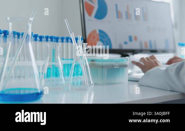 In this dynamic lab, colorful test tubes are organized next to a sleek ...