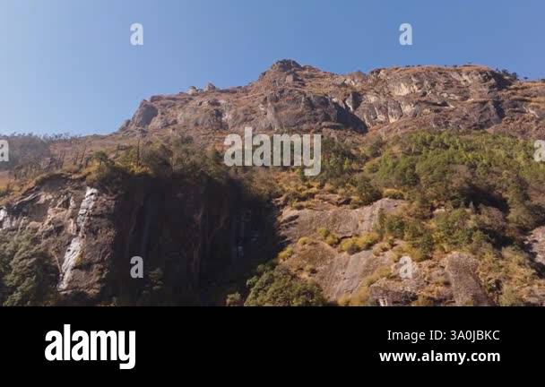 Majestic Himalayan mountains rising above lush mountain slopes, deep ...