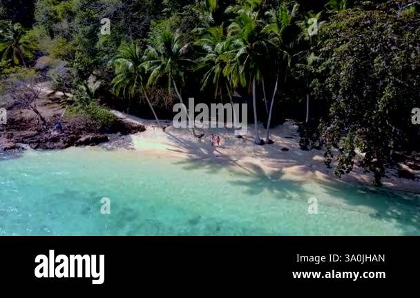 Explore the stunning shores of Koh Wai Island Thailand where clear turquoise waters meet soft ...