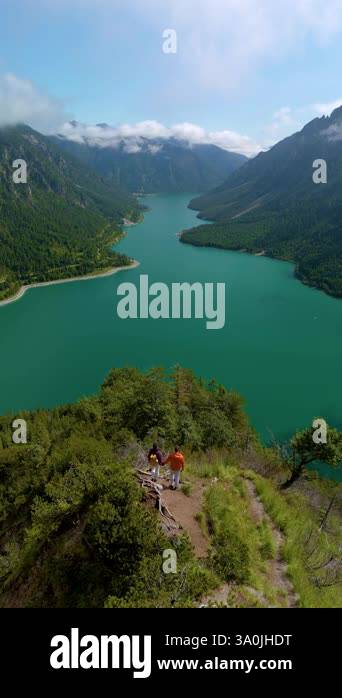 Witness the stunning beauty of Plansee Lake Austria nestled amid ...