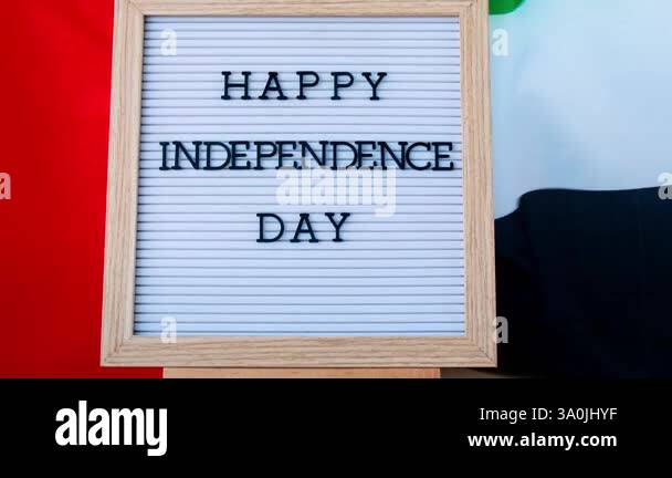 Text HAPPY INDEPENDENCE DAY on background waving flag of UAE. National ...