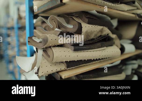 Textile factory. A large warehouse of textile products and goods Stock ...