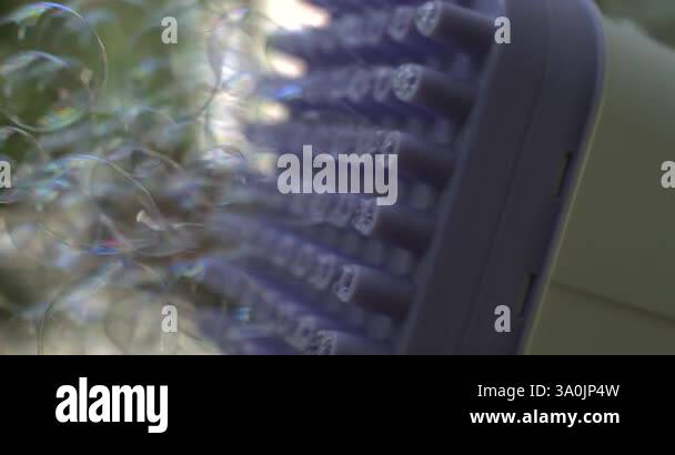 Bubble machine creating bubbles in slow motion at 800 fps, showing ...