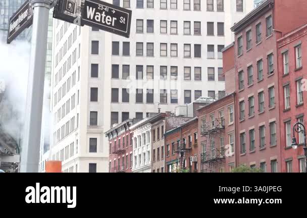 Steam vapor vented, New York City Water street, orange vapour tube ...