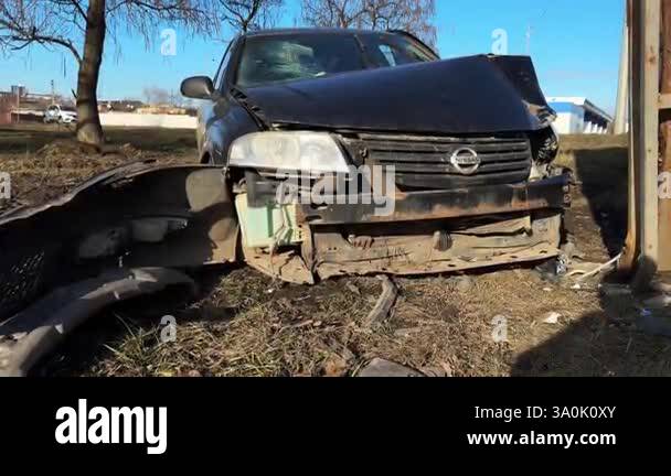Car after an accident on the side of the road, close-up. A black car ...