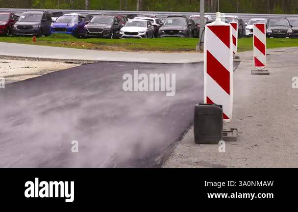 Hot, Steaming Freshly Laid Asphalt. Visible Vapors Rising in the Wind ...