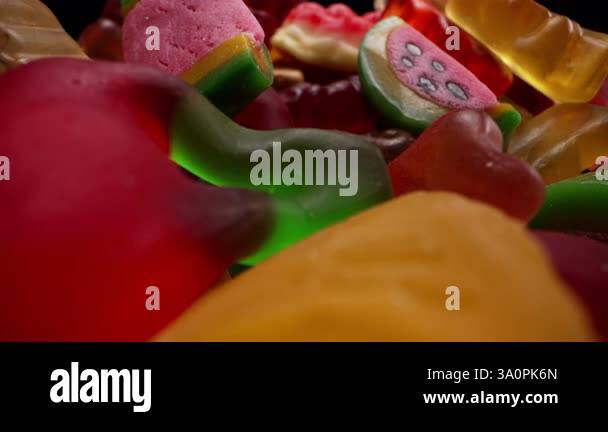 Extreme macro slider view of jelly gummy bears texture background ...