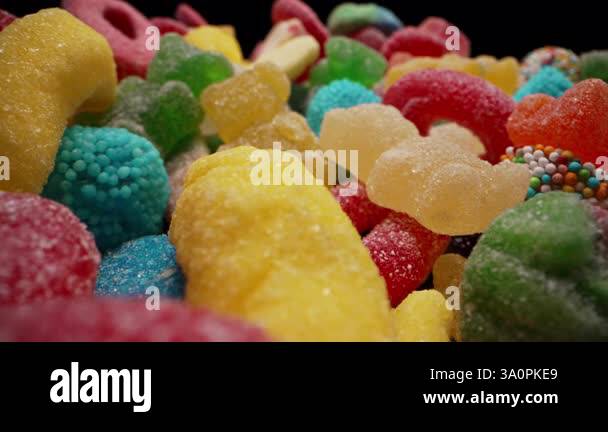 Extreme macro slider view of jelly gummy bears texture background ...