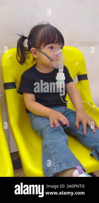 sick toddler baby girl using steam inhaler with nebulizer mask ...