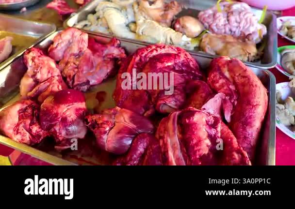 Disgusting fresh pork pig innards meat giblets parts on Thai food ...