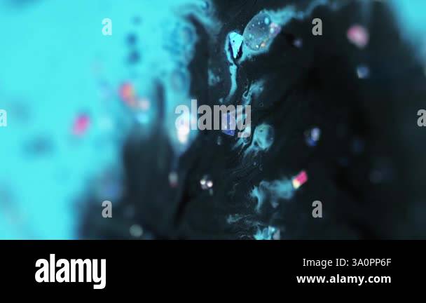 Vertical video. Sparkling paint drip. Glitter fluid texture. Blur black ...