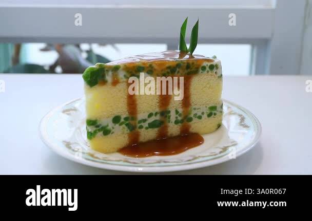 Footage of Hand Scooping Lod Chong Chiffon Cake, a Pandan Flavored Rice ...