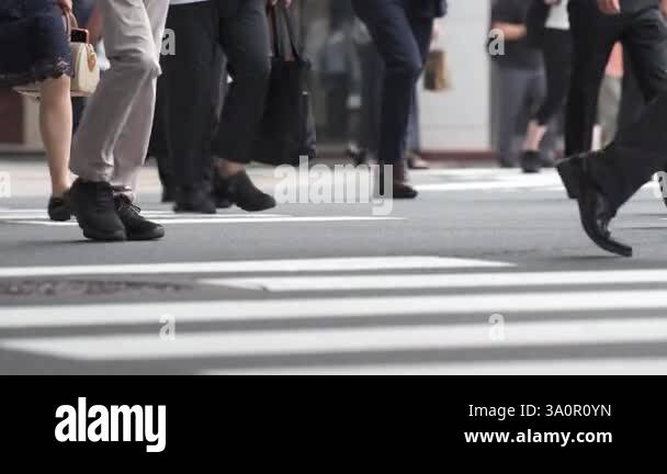 The feet of people walking at the intersection Stock Video Footage - Alamy