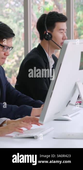 Business people wearing headset working in office to support remote customer or colleague. Call ...