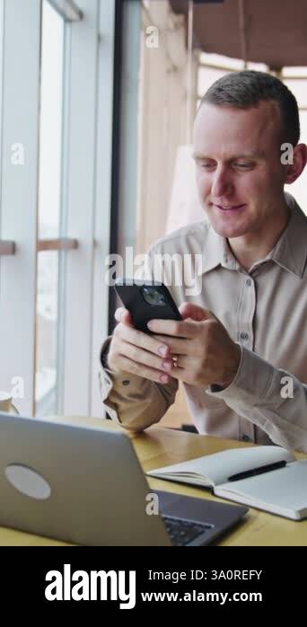 Successful young business worker working with phone. Lifestyle office ...