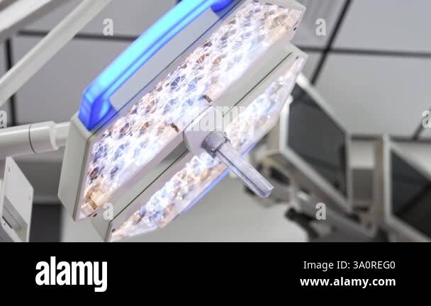 Lamp on the ceiling of the surgery room. Side view. Switched on ...