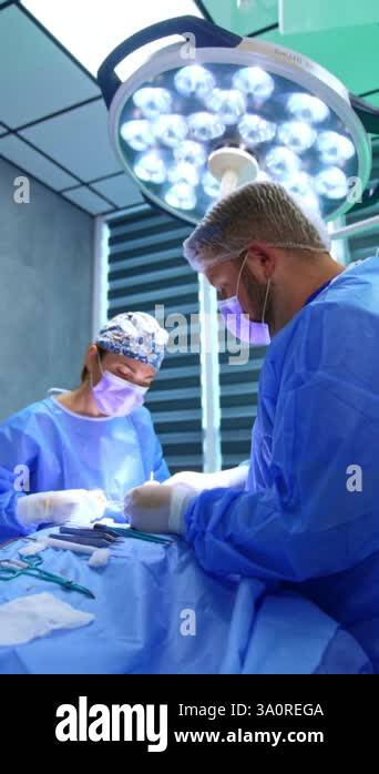 Professional female surgeon chooses the tools from a range of ...