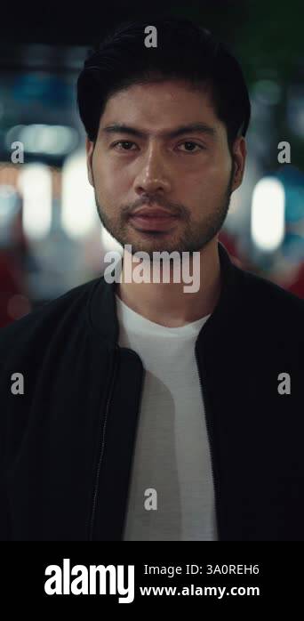 Portrait of asian human switching sight to camera and showing wide ...
